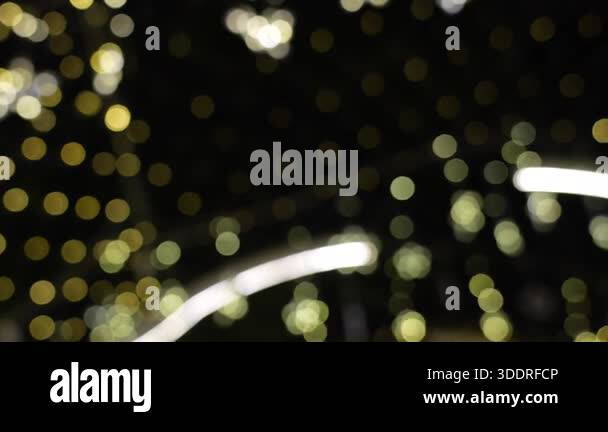 Warm golden bokeh fills the frame with soft circles of unfocused light ...