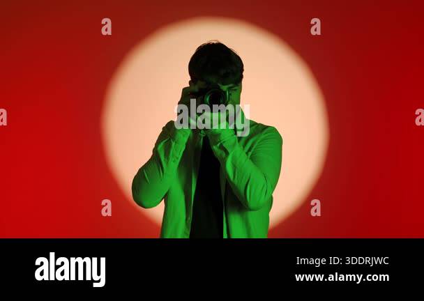 Backstage at a professional studio with a photographer in a green shirt ...