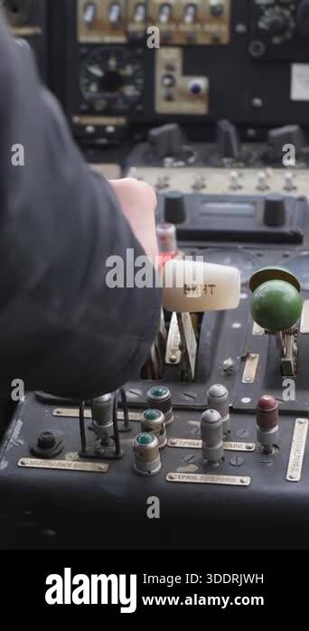 Vertical video. Pilot push thrust lever handle for takeoff a old plane ...