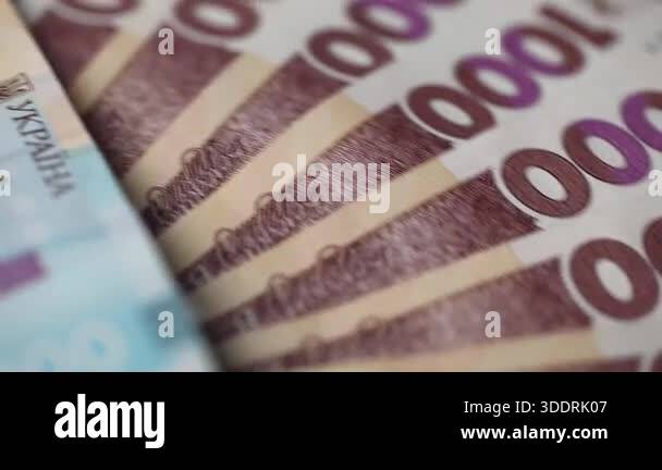 Ukrainian national currency circle stack turns fast in bright light ...