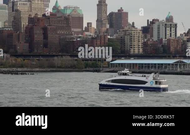 City Ferry Crossing River Past Skyline, Overcast Waterfront Scene With ...