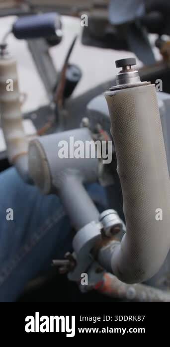 Vertical video. Close up. Male hands of the pilot take the steering ...