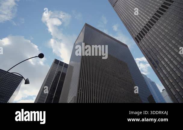 Blue Sky View Of Skyscrapers From StreetLevel Perspective Shows Glass ...