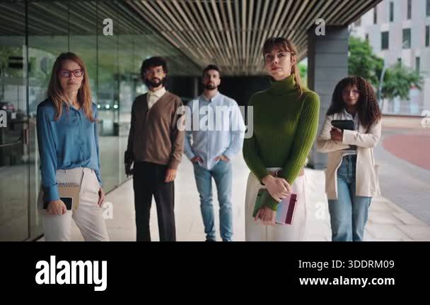 Group of confident diverse business people standing together outside a ...