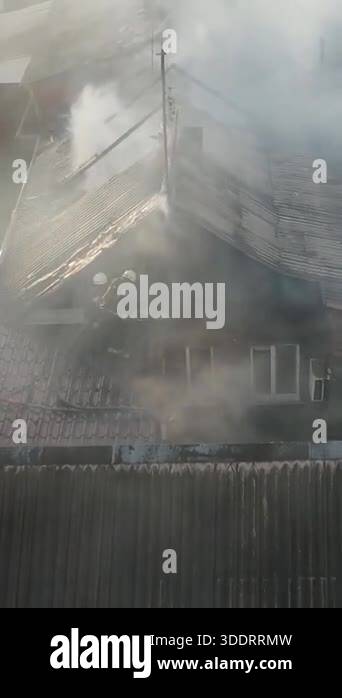 Fighting a major fire in a residential area: an aerial view of ...