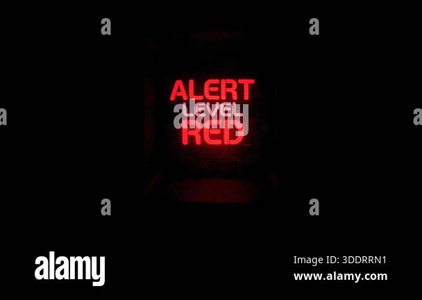 A stark red 'ALERT LEVEL RED' warning sign flashes ominously against a ...