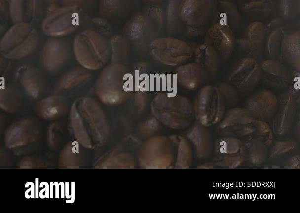 Roasted Coffee Beans With Swirling White Smoke on Black Background Copy ...