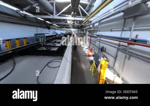 Close up workers in tram transport factory. Tram inside. Spare parts ...