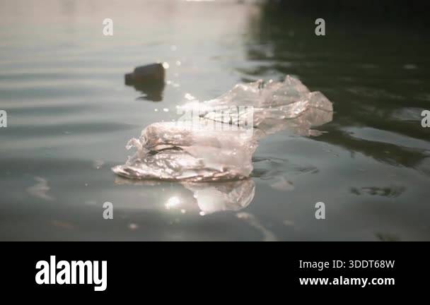Water pollution. Closeup scene of polluted dirty calm river water with ...