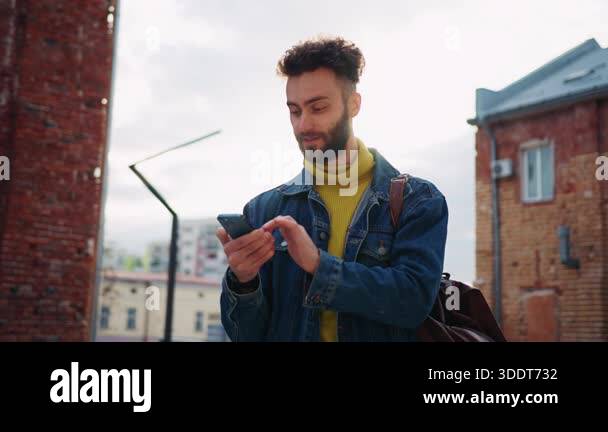 Shooting of euphoric bearded guy celebrating win with yes gesture on ...