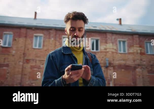 Horizontal shot of young confident man with stylish haircut using ...