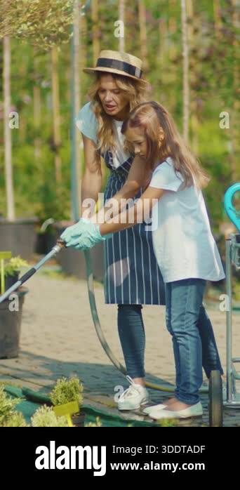 A mother and daughter bond deeply while joyfully gardening together ...