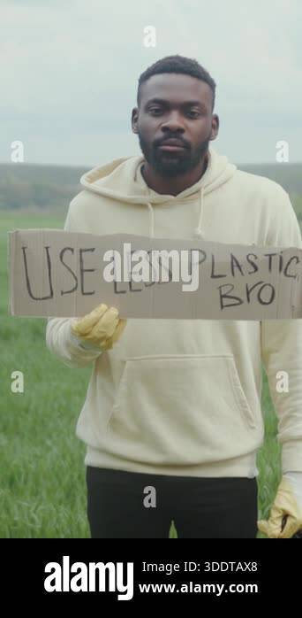 A passionate advocate holding a vibrant sign that promotes the urgent ...