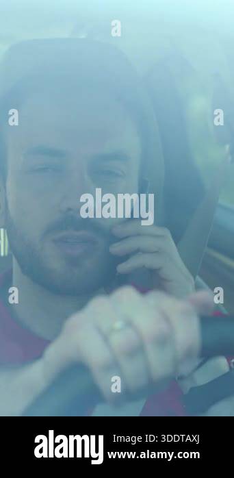 A man is currently driving a car while simultaneously engaged in a ...