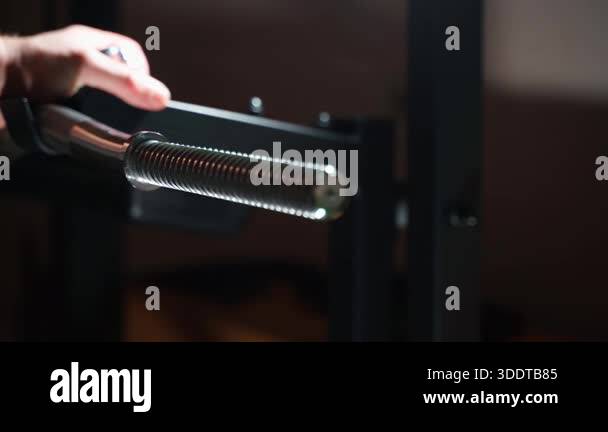 Removing and putting on athletic pancakes from the barbell neck, close ...