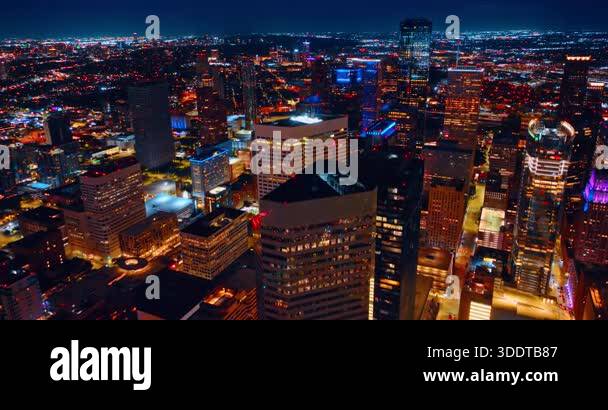 Rising over luminous city scenery of Houston, Texas, USA. Revealing ...