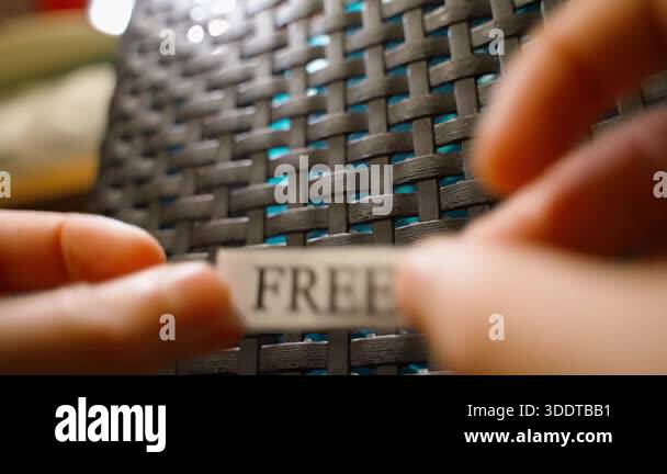 A FREE sticker is stuck on a plastic box with various things. Free ...