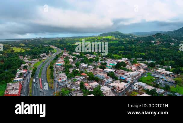 Lively roads cross the cityscape of modern Puerto Rico. Drone footage over the beautiful scenery ...