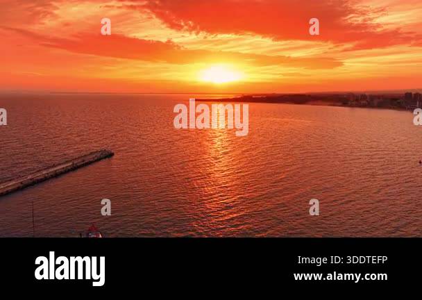 Amazing setting sun coloring the sky and vast waterscape. Rising over ...