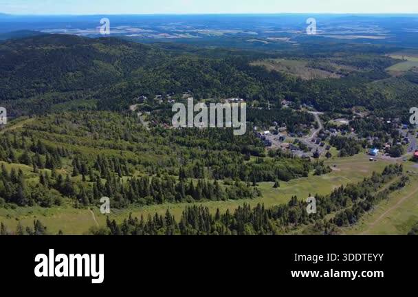 Panoramic aerial view above Val d'Irene Regional Park and its hamlet ...
