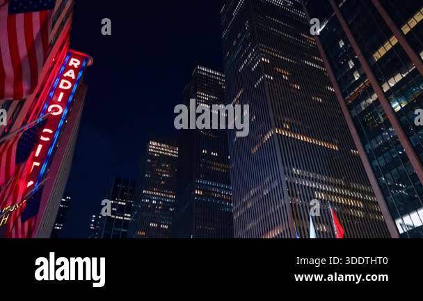 High-rise buildings of New York at night from low-angle perspective ...