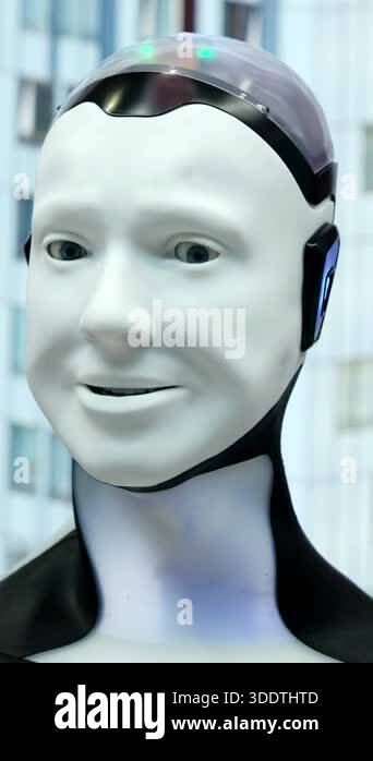 Realistic humanoid robot showing different facial expressions on ...