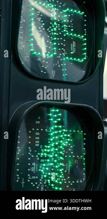 Countdown pedestrian traffic light changing numbers from green to red ...