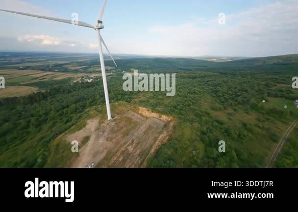 Stunning flight to wind station. Cinematic green rural landscape with ...
