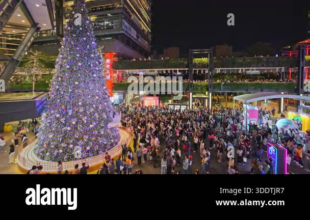 Taipei, Taiwan - December 20, 2025. Crowds gather at the illuminated ...