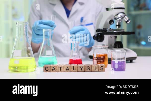 Laboratory worker pours azure solution into clean glass test tube ...