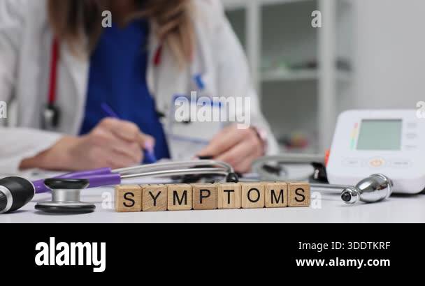 Wooden blocks spell word Symptoms near stethoscope and blood pressure ...