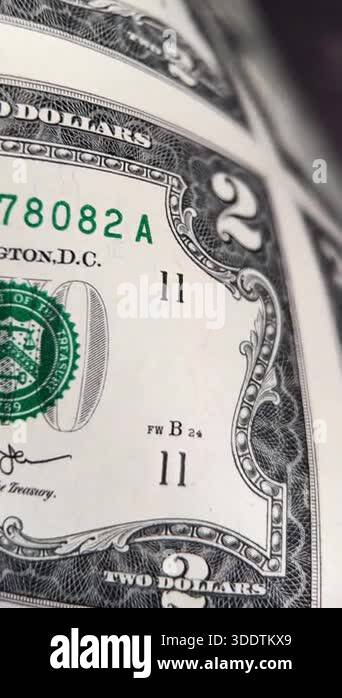 Extreme close look at two dollar bills printed on a large uncut sheet ...