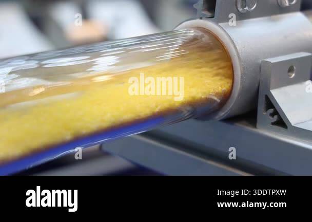 Plastic pellets air tubes. Close up of transparent industrial tube ...