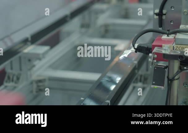 Automated conveyor line. Auto system moving plastic storage bins ...