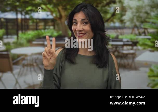 Woman shows peace sign face Stock Videos & Footage - HD and 4K Video ...