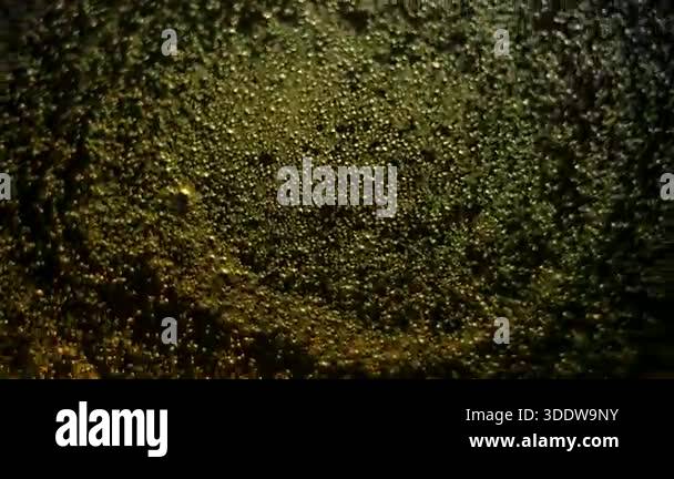 4K 59.94fps Golden Orange Bubbles Swirling Clockwise on Dark Liquid ...