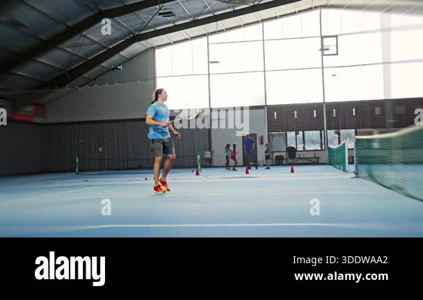 player sprinting across blue indoor court, sharp lateral footwork ...