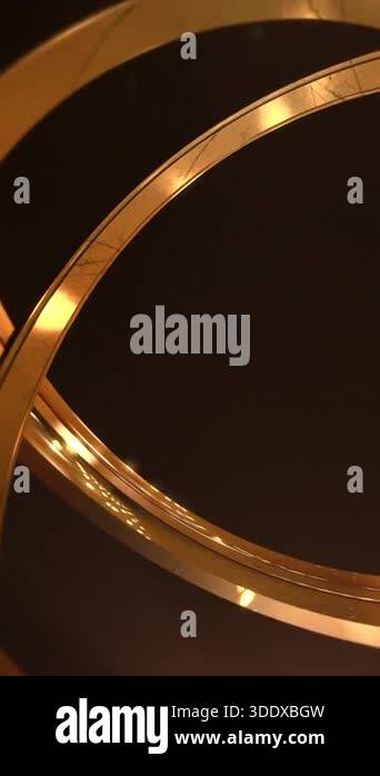 Glossy Gold Rings Loop Across, Reflective Bands, Continuous Rotation ...