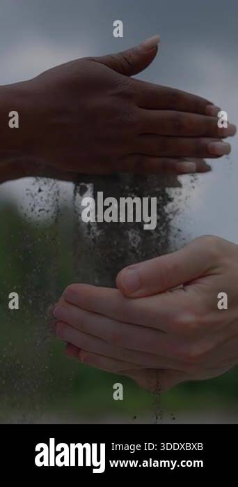 Two hands gently exchanging rich soil, symbolizing unity, growth, and ...
