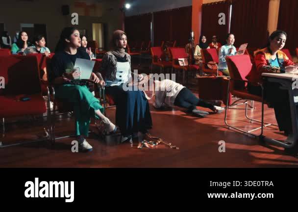 Low-angle tracking shot capturing a dramatic theater rehearsal. One ...