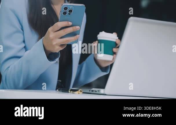 businesswoman using a calculator to calculate the numbers for financial ...