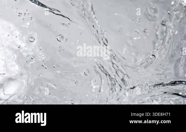 Super Slow Motion Shot of Pure Water Followed by Camera Splashing into ...