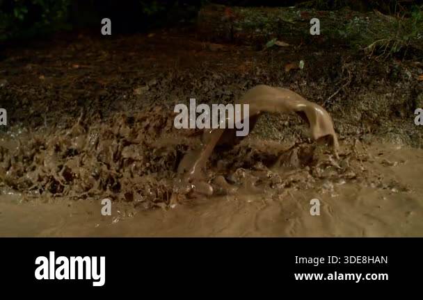 Super Slow Motion Shot of Flying and Splashing Mud in Nature at 1000fps ...