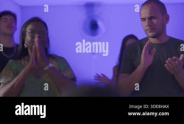 People clapping during evangelical church gathering, expressing joy and ...