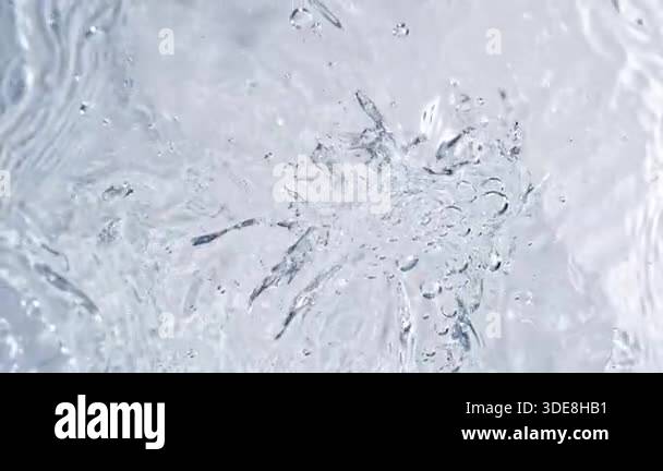 Super Slow Motion Shot of Pure Water Followed by Camera Splashing into ...