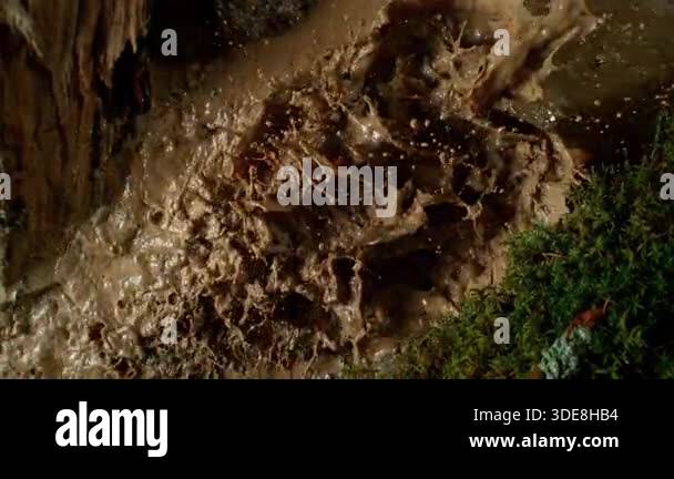 Super Slow Motion Shot of Flying and Splashing Mud in Nature at 1000fps ...