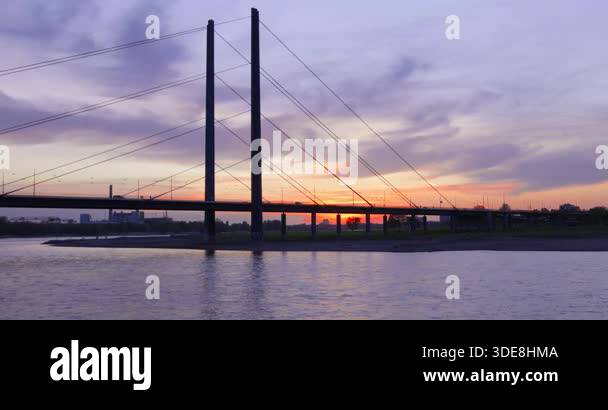 Captivating Sunset Over Tall Pylon Cable-Stayed Bridge Spanning Wide ...