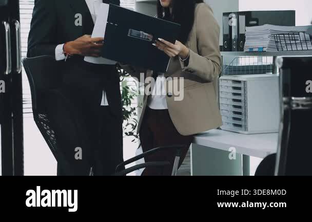 businesswoman using a calculator to calculate the numbers for financial ...