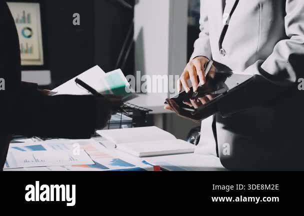 businesswoman using a calculator to calculate the numbers for financial ...