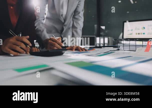 businesswoman using a calculator to calculate the numbers for financial ...